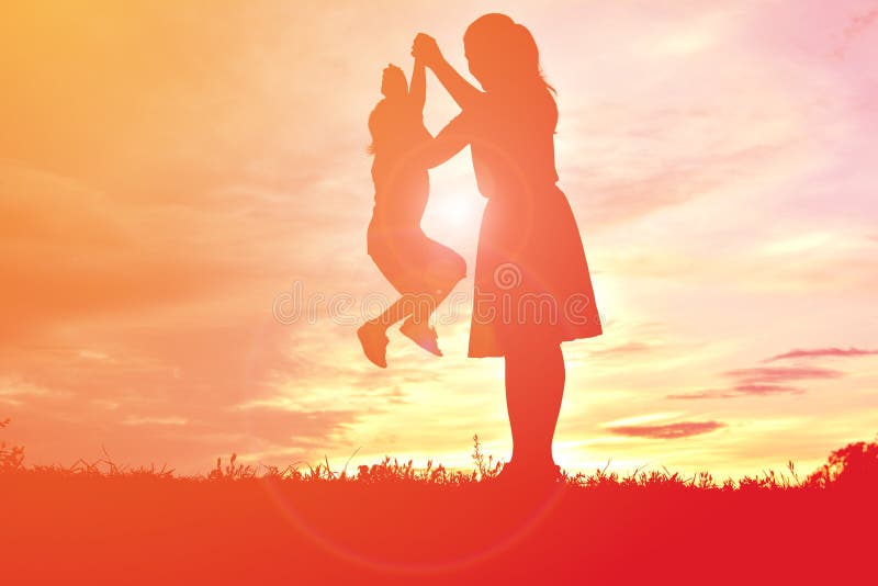 Silhouettes Mother And Daughter Hugging On Sunset Stock Image Image