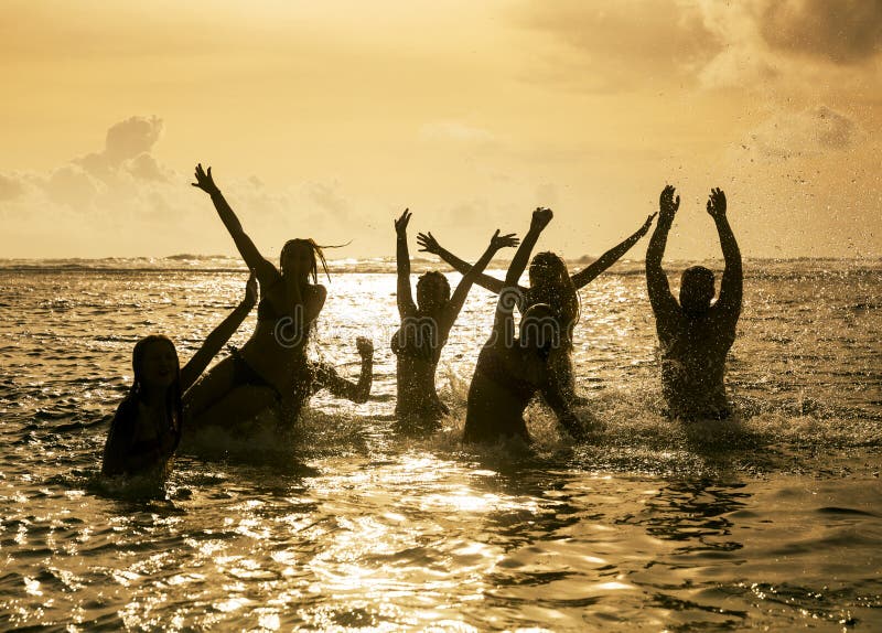 Silhouettes of People Jumping in Ocean Stock Image - Image of summer ...