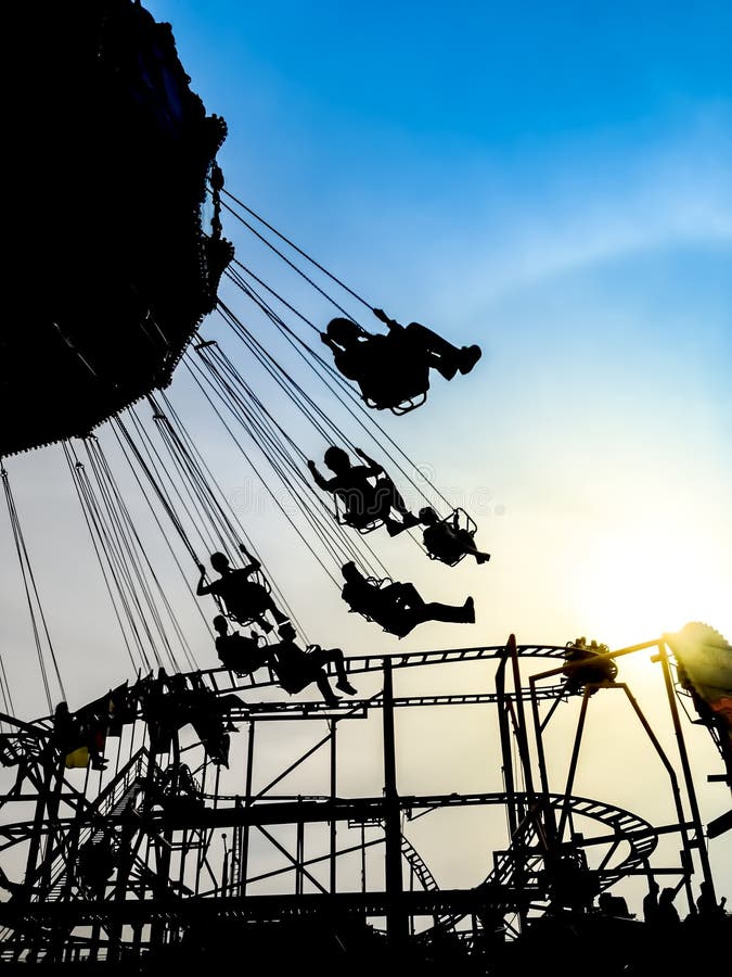 Silhouettes of People on a Merry Go Round Stock Image - Image of ...