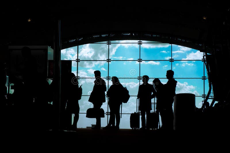 Silhouettes of People Waiting for Their Flight at the Airport. Stock ...