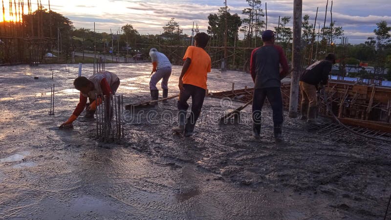 Silhouettes of Workers on a Construction Site, during the Hot Sun ...