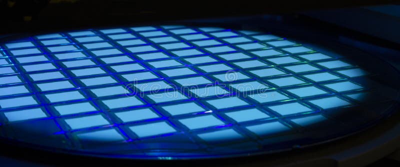 Silicon Wafer with Chips in UV Lighting. Neon. Ultraviolet Lithography ...