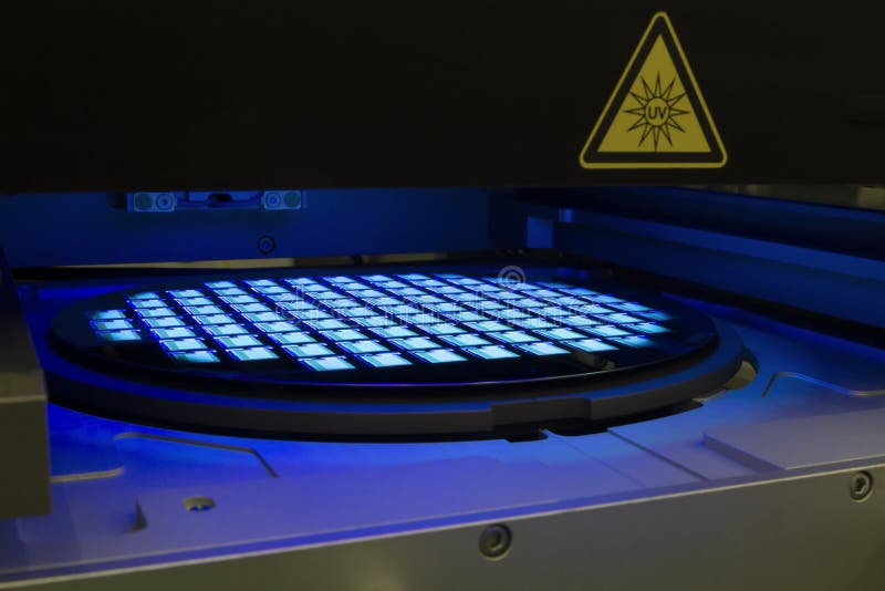 Silicon Wafer with Chips in UV Lighting. Neon. Ultraviolet Lithography ...