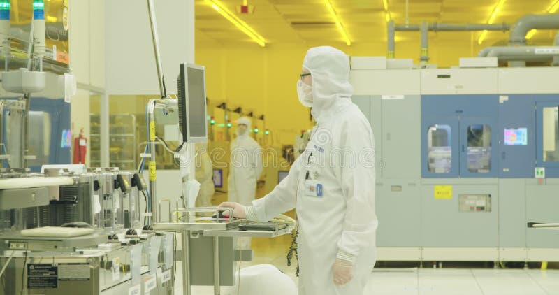 Workers in Clean Room in a Semiconductors Manufacturing Facility Stock ...