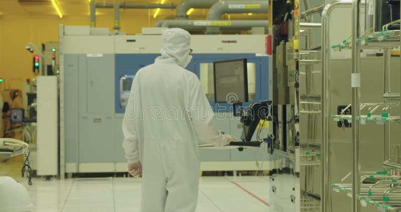 Workers in Clean Room in a Semiconductors Manufacturing Facility Stock ...