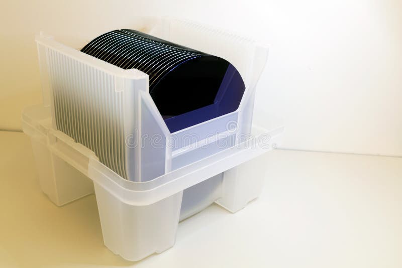 Silicon Wafers in White Plastic Holder Box on a Table- a Wafer is a ...