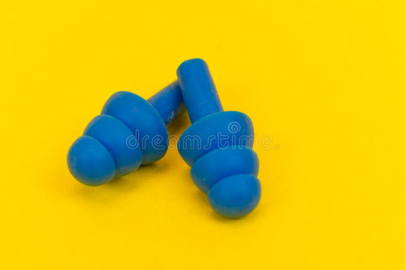 Silicone Ear Plugs for Human Ears on Yellow Background Stock Photo ...