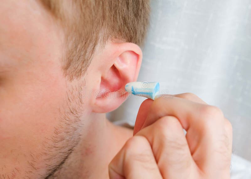 Silicone Earplug Next To the Ear. Insert Ear Protection Stock Photo ...