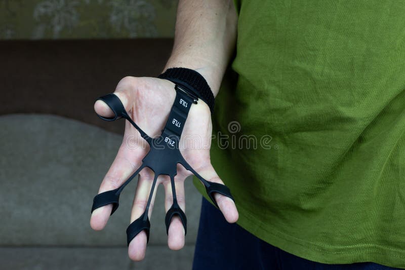 Silicone Finger Exerciser on Hand with Spread Fingers Stock Image ...