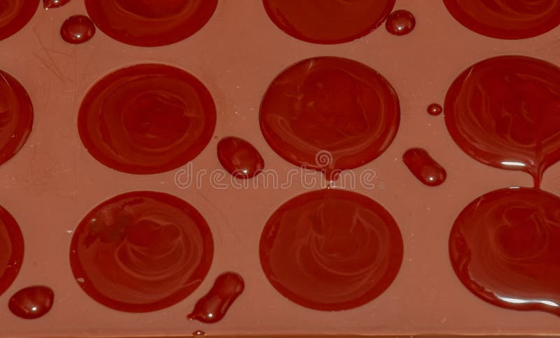 Silicone Molds for Shaping Chocolate and Sweets are Filled with Hot ...