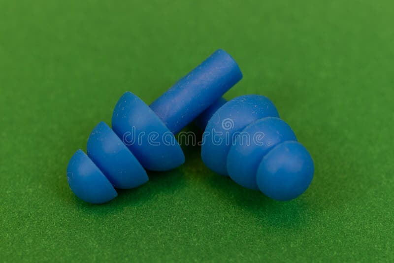 Silicone Reusable Ear Plugs for Human Ears on Green Background Stock ...
