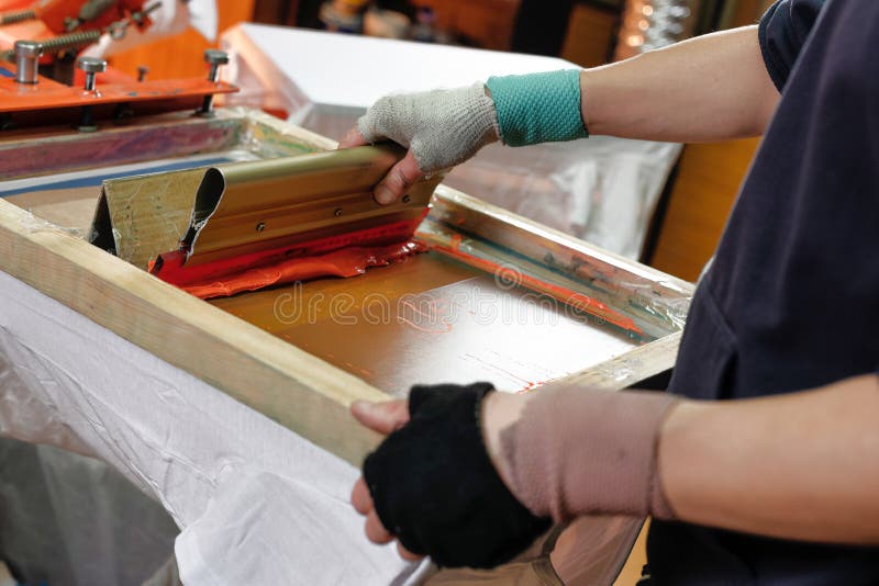 Silk Screen Printing. Male Hand with a Squeegee. Serigraphy Production ...