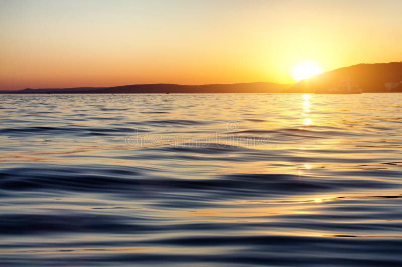 Silky Smooth Water with Sunset in the Background Stock Image - Image of ...
