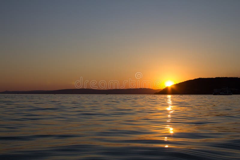 Silky Smooth Water with Sunset in Background Stock Image - Image of ...