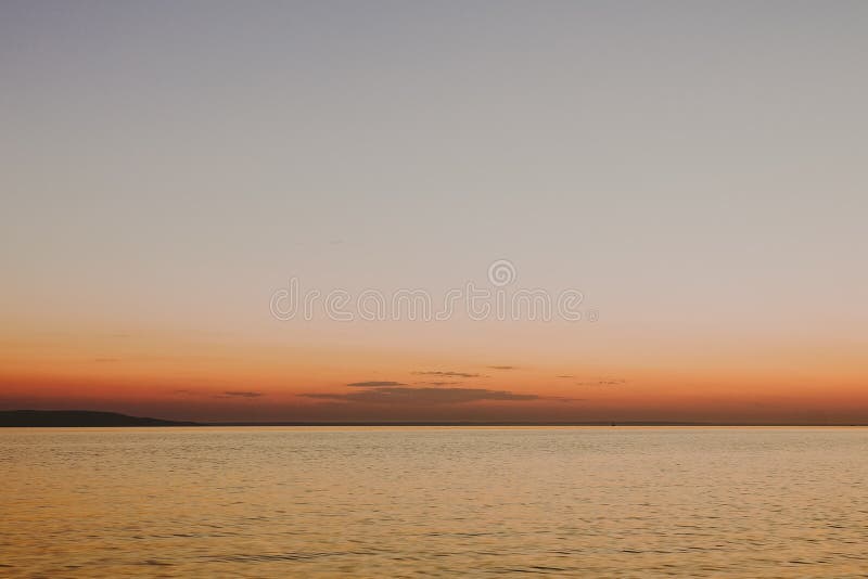 Silky Smooth Water with Sunset in Background Stock Image - Image of ...