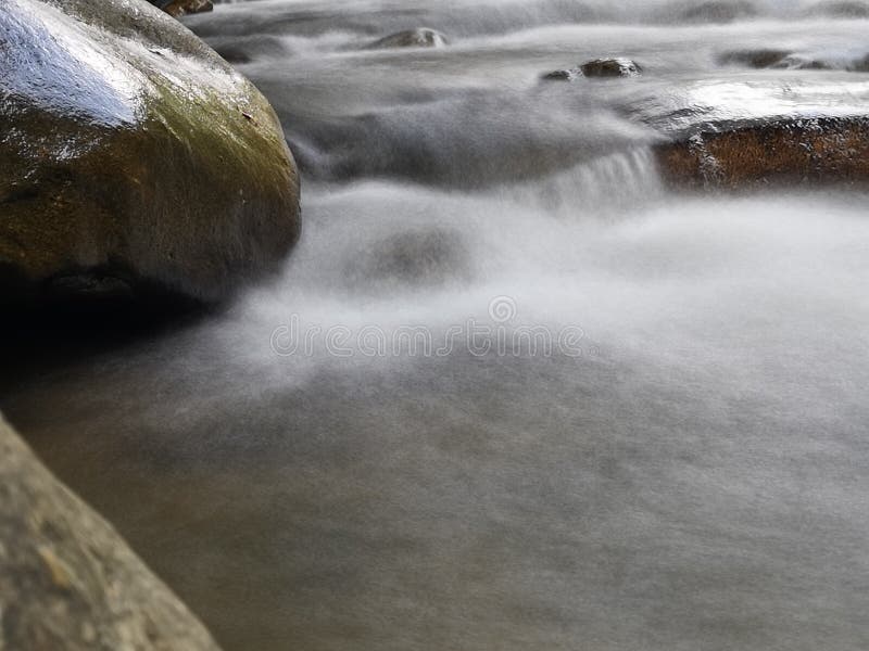 Silky water from waterfall stock photo. Image of coast - 233116978
