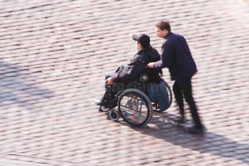 Sillón de ruedas imagen de archivo. Imagen de pavimento - 1305357