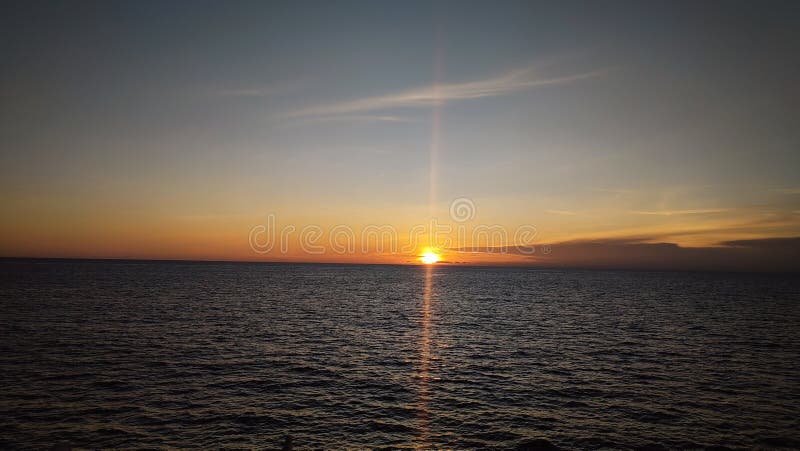 Sillhoute Sunset in the Middle of the Ocean Sea Stock Image - Image of ...