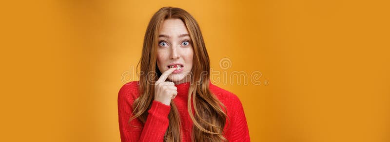Silly Cute Redhead Woman Making Innocent Oops Expression Holding