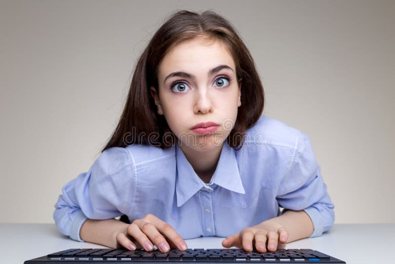 Silly Young Woman Using Keyboard Stock Photo - Image of device, cheeks ...