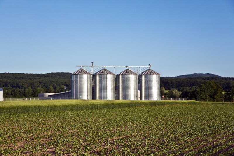 Silos in Beautiful Landscape Stock Photo - Image of blue, metal: 69622708
