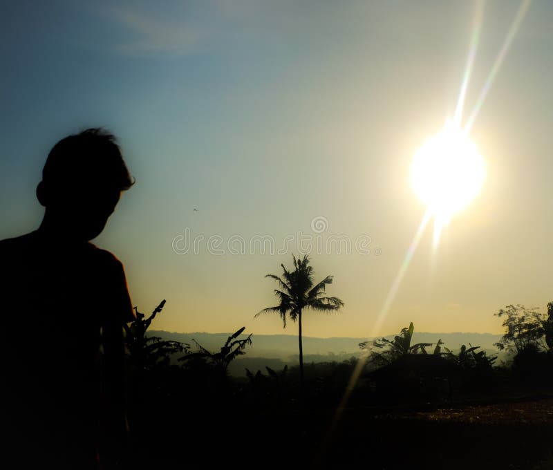 Siluet boy on sunset stock photo. Image of dusk, evening - 216362476