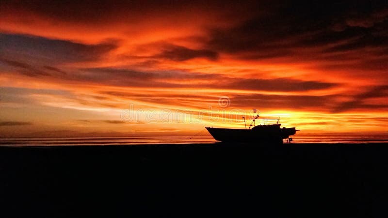 Siluet in sunset stock image. Image of sunset, orangesky - 244097499