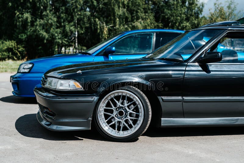 Silver Alloy Wheels. Black Racing Car Stock Photo - Image of event ...