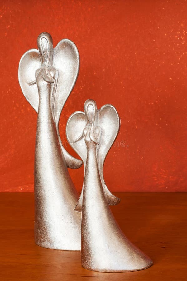 Silver Angel Statue Holding a Burning Candle in Closeup, Christmas and ...