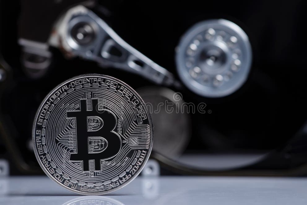 Silver Bitcoin Coin on Background the Opened HDD Disk. Electronic Money ...