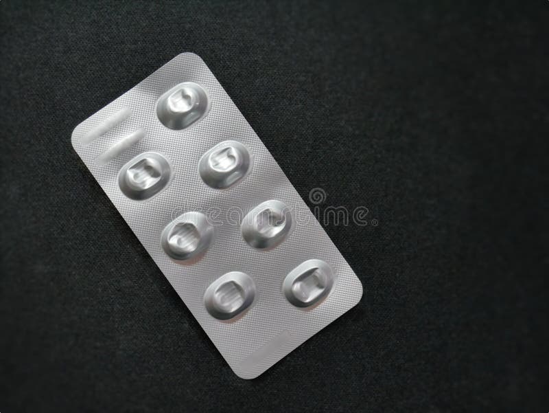 Silver Blister Pack of Medication Pills on Black Background with ...