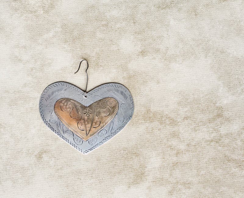 Silver and Brass Heart on Tan Variegated Background Stock Image - Image ...