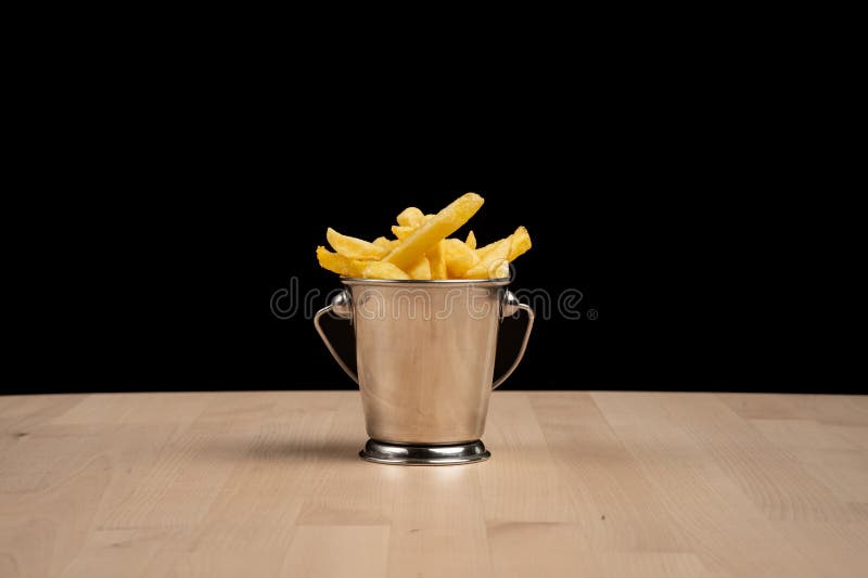 Silver Bucket of French Fries on a Table Stock Photo - Image of golden ...