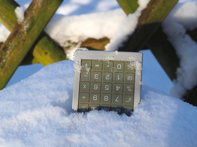 Silver Calculator with Keys in the Snow Stock Photo - Image of stream ...