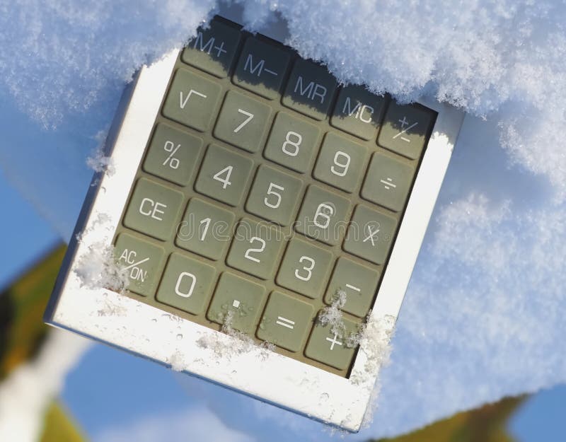 Silver Calculator with Keys in the Snow Stock Photo - Image of ...