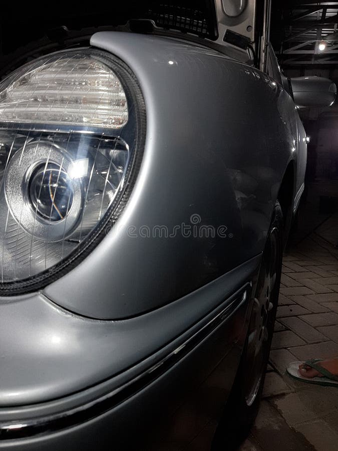 Silver Car with Shiny Lamp in Garage Stock Photo - Image of silver ...
