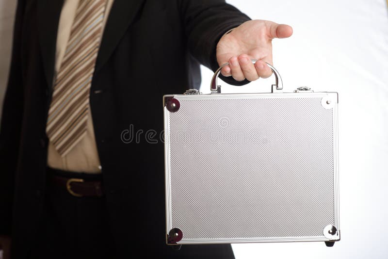 Silver case in hand stock image. Image of store, case - 16759333