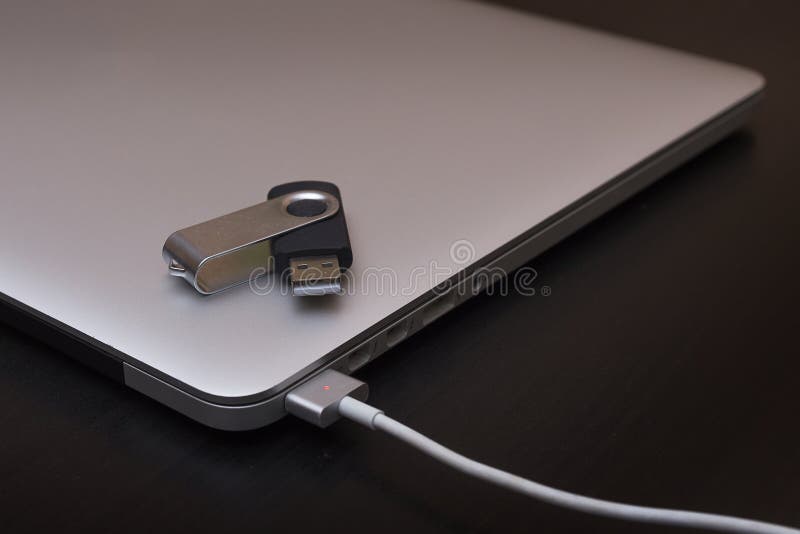 Silver Charging Laptop with Flash Usb Disk on Key. Stock Image - Image ...