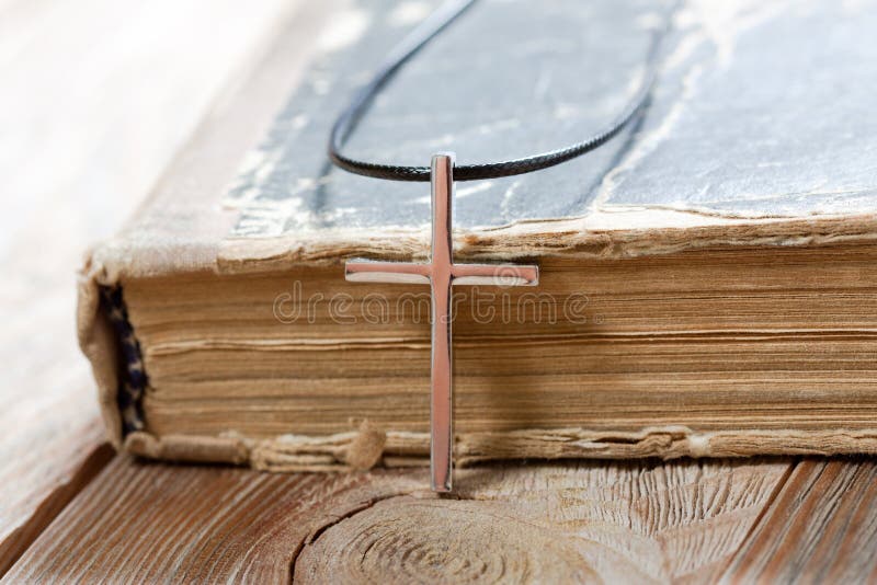 Silver Christian Cross on Bible Stock Photo - Image of bevel, christ ...