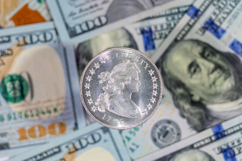 Silver Coin 1 US Dollar on a Background of US Paper Banknotes. Ounce of ...