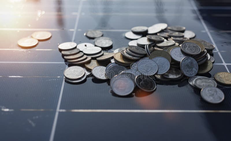 Silver Coins on the Solar Panel Help Store Solar Energy Stock Photo ...