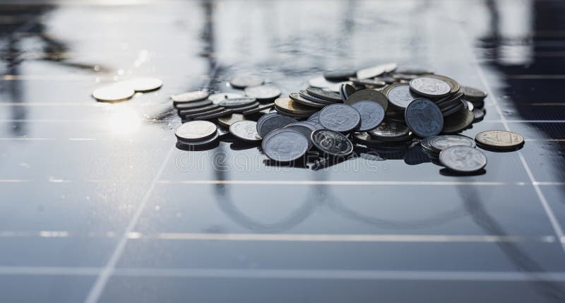 Silver Coins on the Solar Panel Help Store Solar Energy Stock Photo ...
