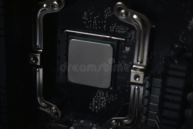 Silver Computer Processor on a Black Motherboard Stock Photo - Image of ...