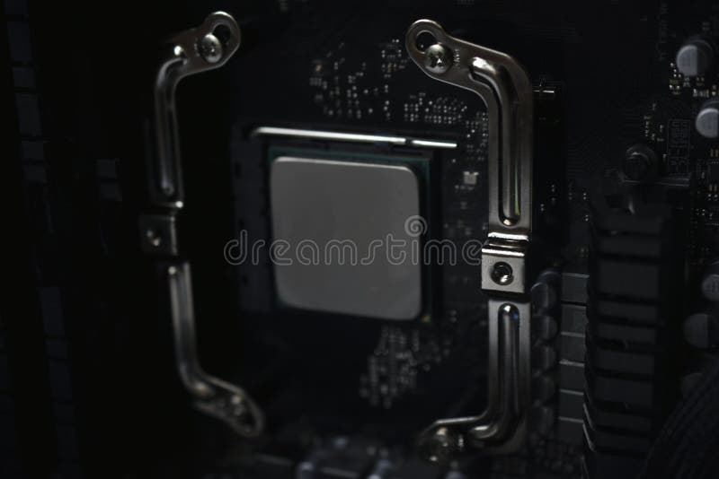 Silver Computer Processor on a Black Motherboard Stock Image - Image of ...