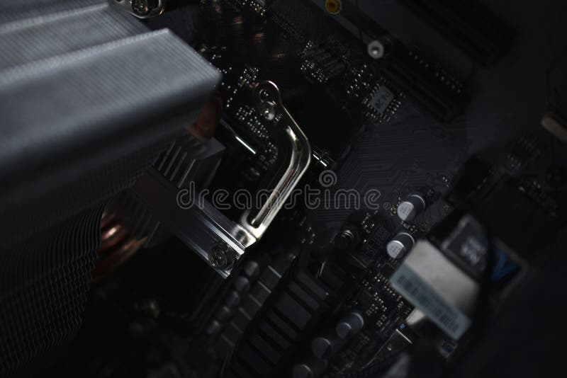 Silver Computer Processor on a Black Motherboard Stock Photo - Image of ...