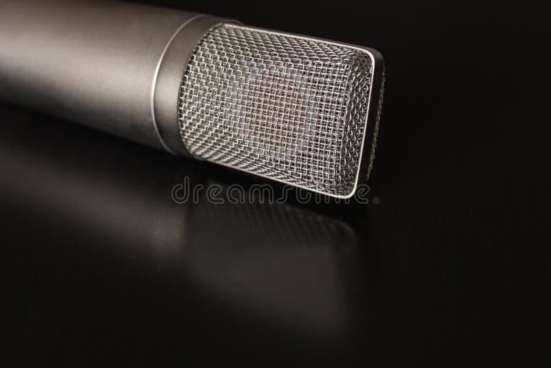 A Microphone Reflecting Off a Shiny Surface Stock Image - Image of ...