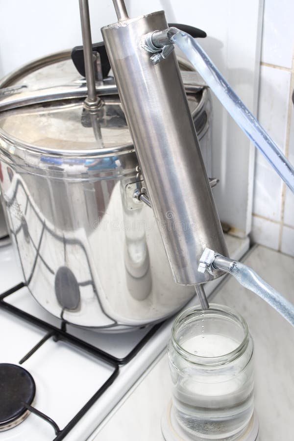 Home Alcohol Product. Cooking Moonshine in the Kitchen. Silver ...