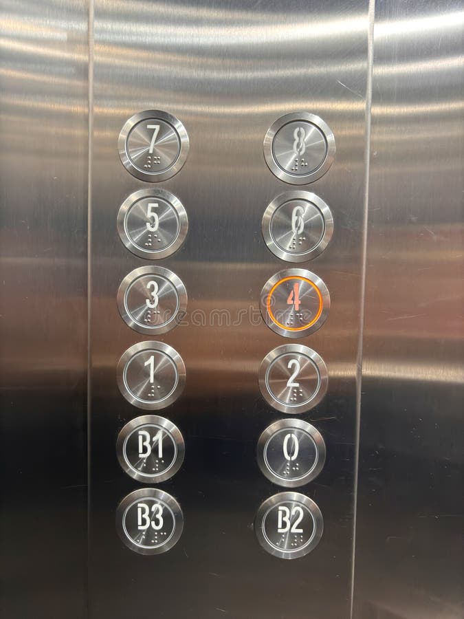 A Silver Elevator with a Red Circle on the Number 4 Stock Photo - Image ...