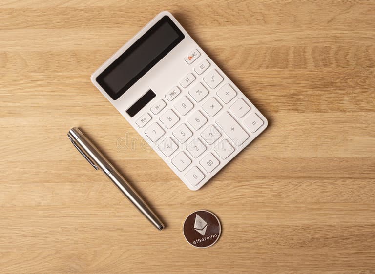 Silver Etherium Coin on Calculator. Cryptocurrency in Accounting ...