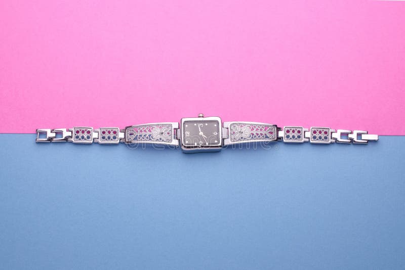 Silver Female Wrist Watch Isolated on Pink and Blue Stock Photo - Image ...